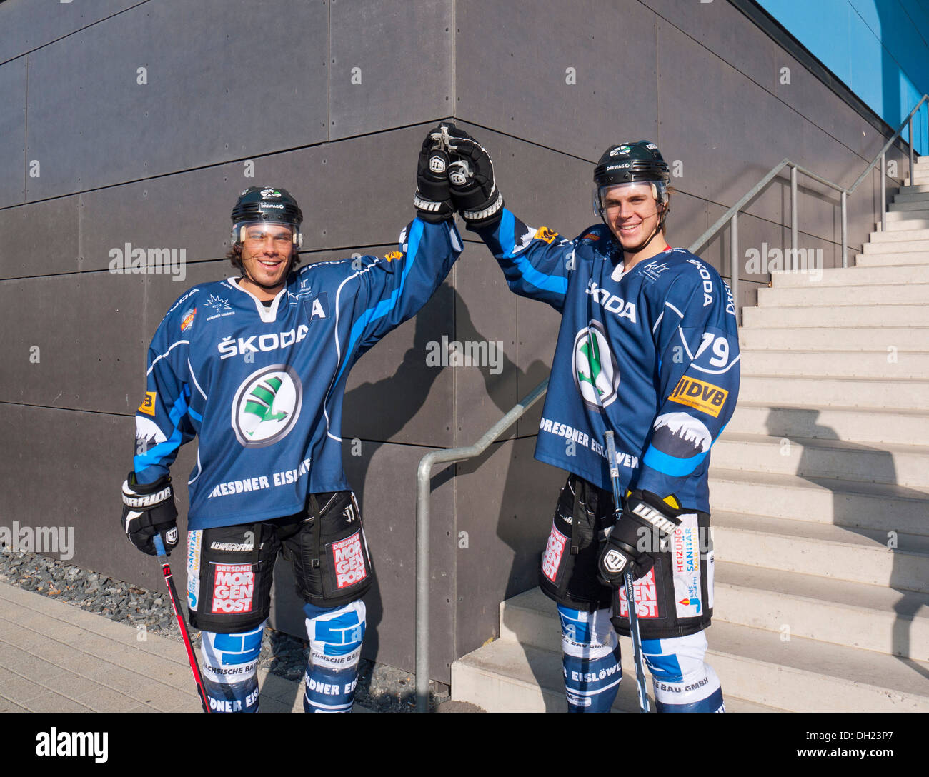 Two ice hockey players, Patrick Strauch, on the left, and Henry Martens ...