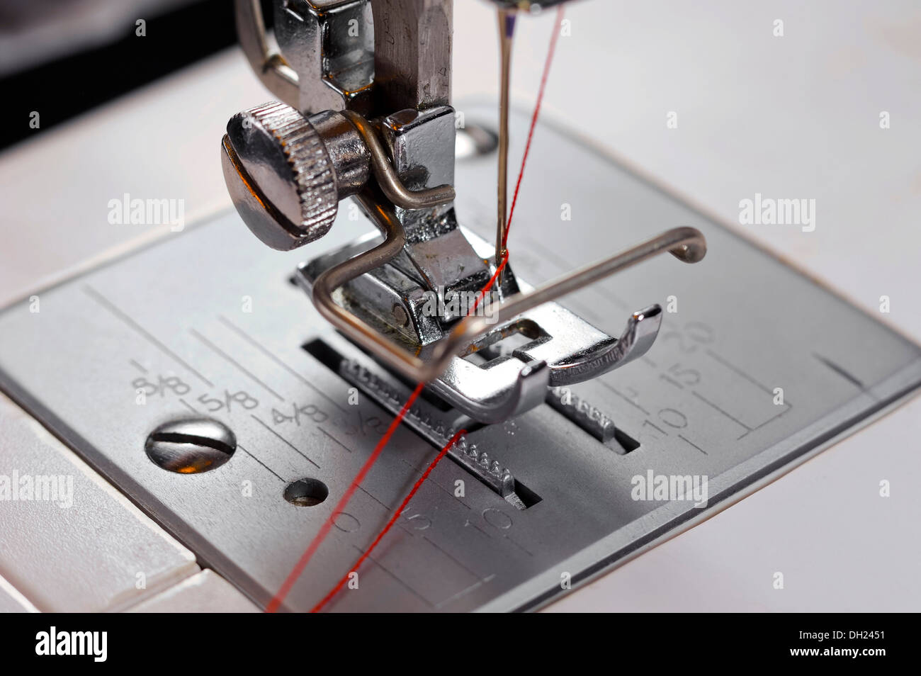 Sewing machine with presser foot and needle plate Stock Photo - Alamy