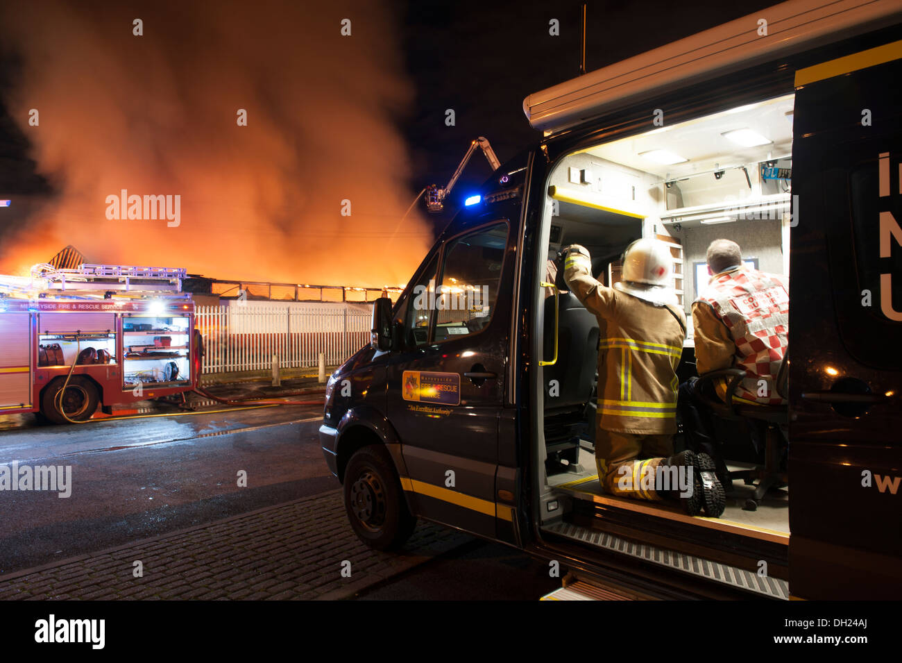 Factory on fire at night Command Vehicle Stock Photo - Alamy