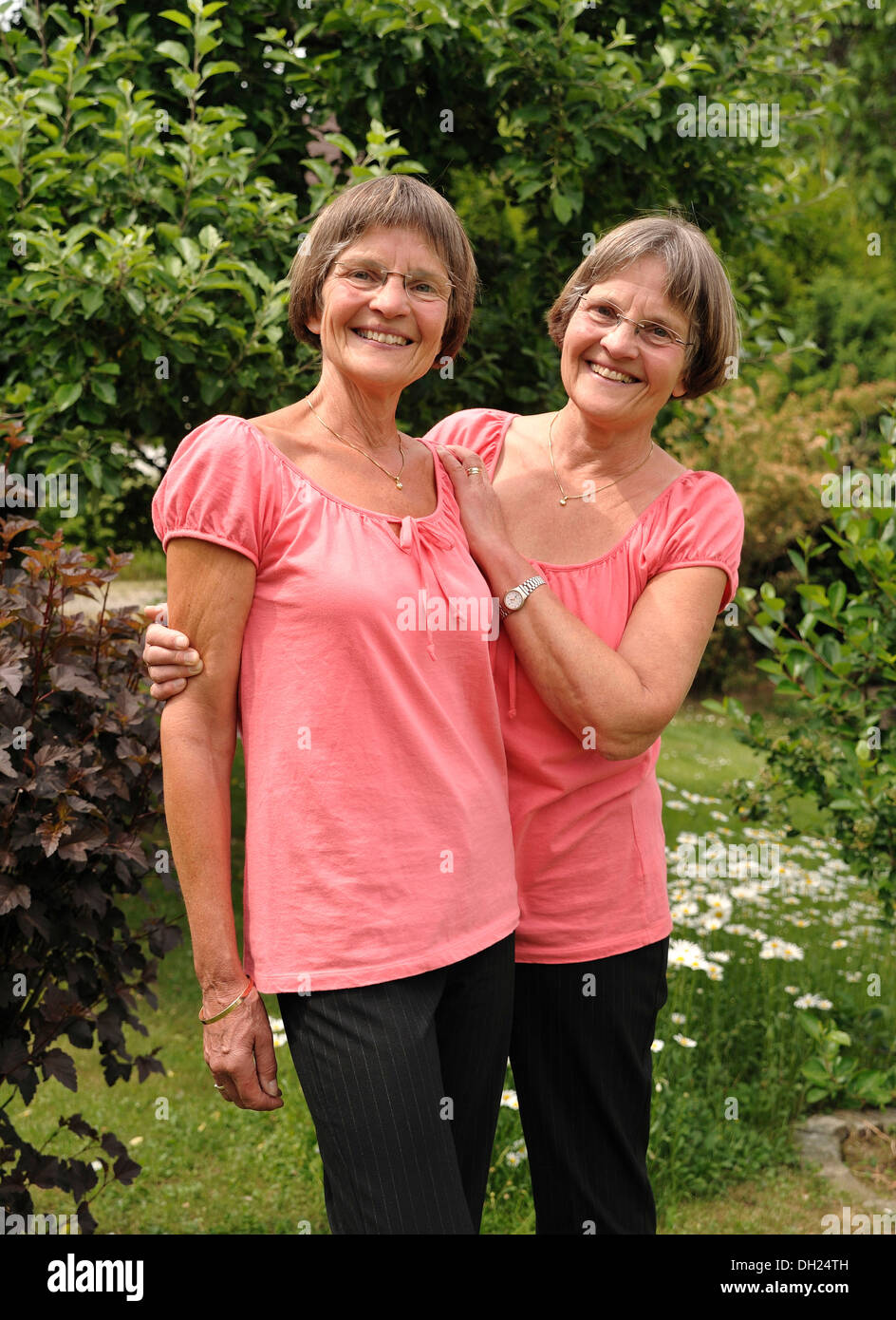 Two sprightly twin sisters Stock Photo - Alamy