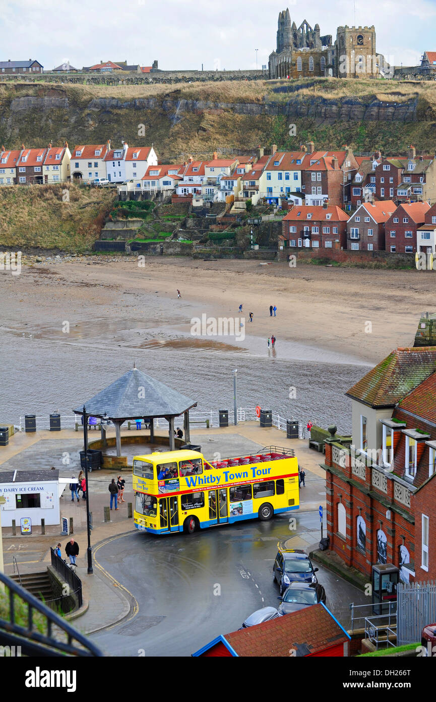 Open deck Whitby tour bus at the harbour front on a wet day Stock Photo ...