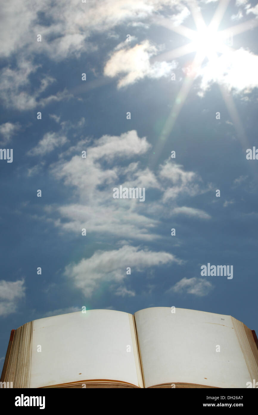 book of wisdom on sun sky background Stock Photo - Alamy