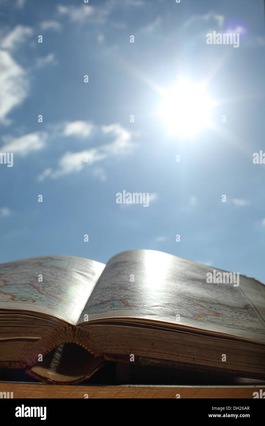book of wisdom on sun sky background Stock Photo - Alamy