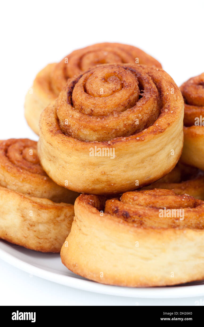 Cinnamon rolls group on the plate, white background Stock Photo - Alamy