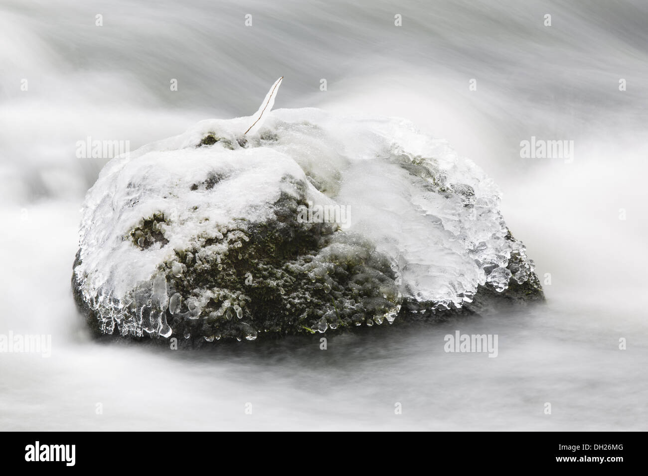 Ice on a rock Stock Photo - Alamy