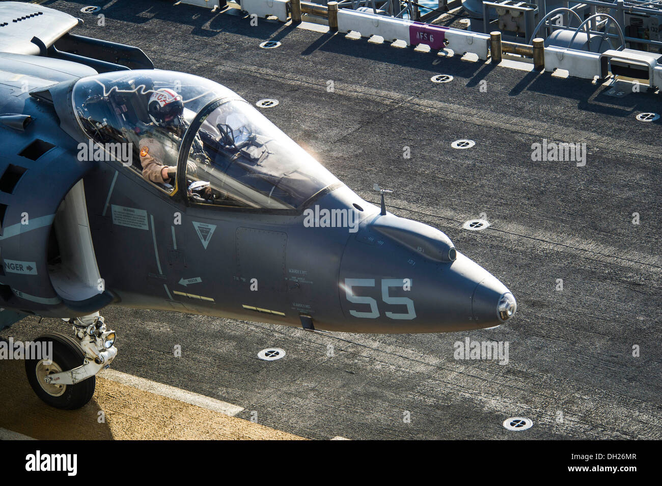 AV-8B Harrier pilot prepares to take off of the multipurpose amphibious ...