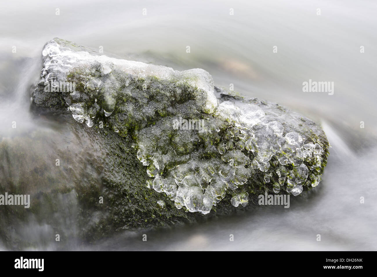 Ice on a rock Stock Photo - Alamy
