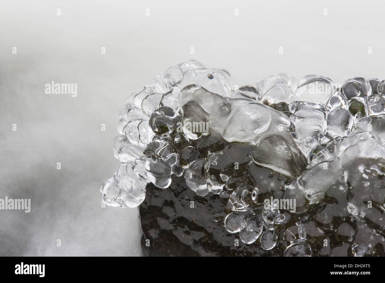 Ice on a rock Stock Photo - Alamy