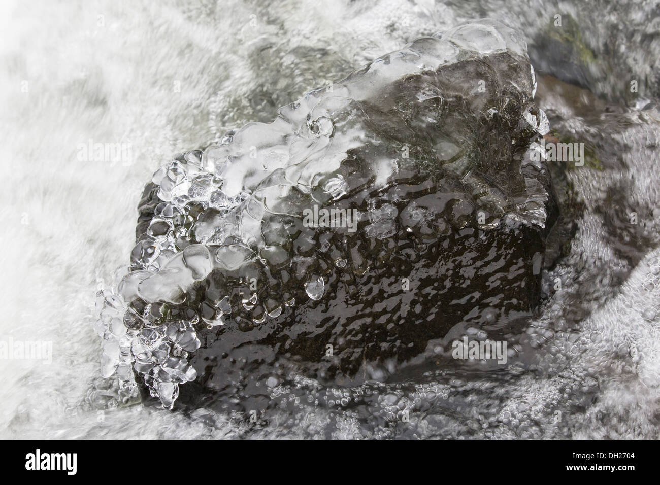 Ice on a rock Stock Photo - Alamy