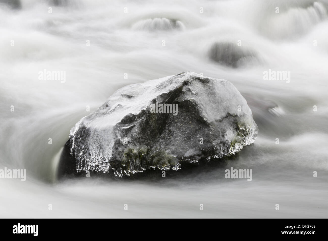 Ice on a rock Stock Photo - Alamy