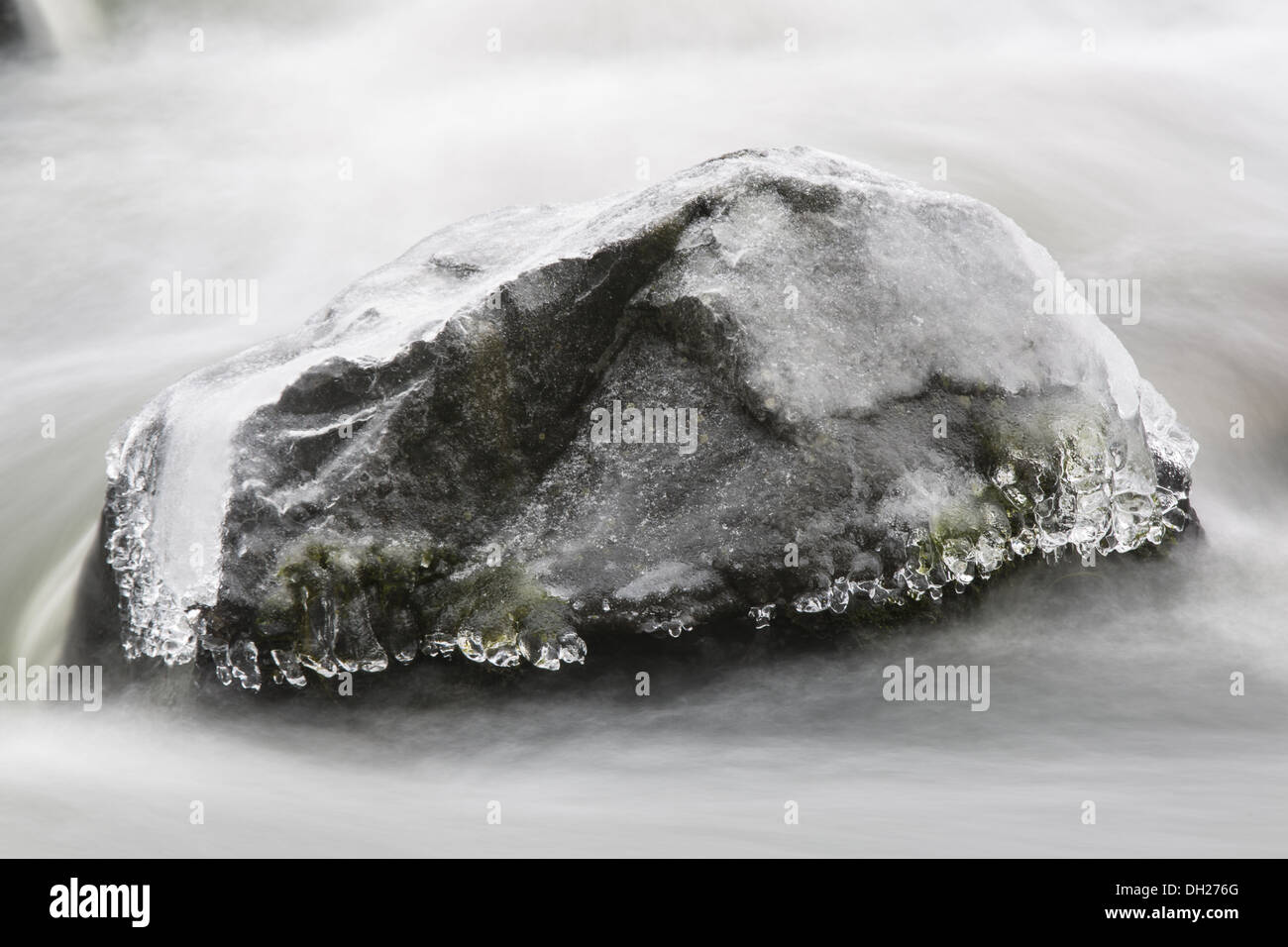 Ice on a rock Stock Photo - Alamy