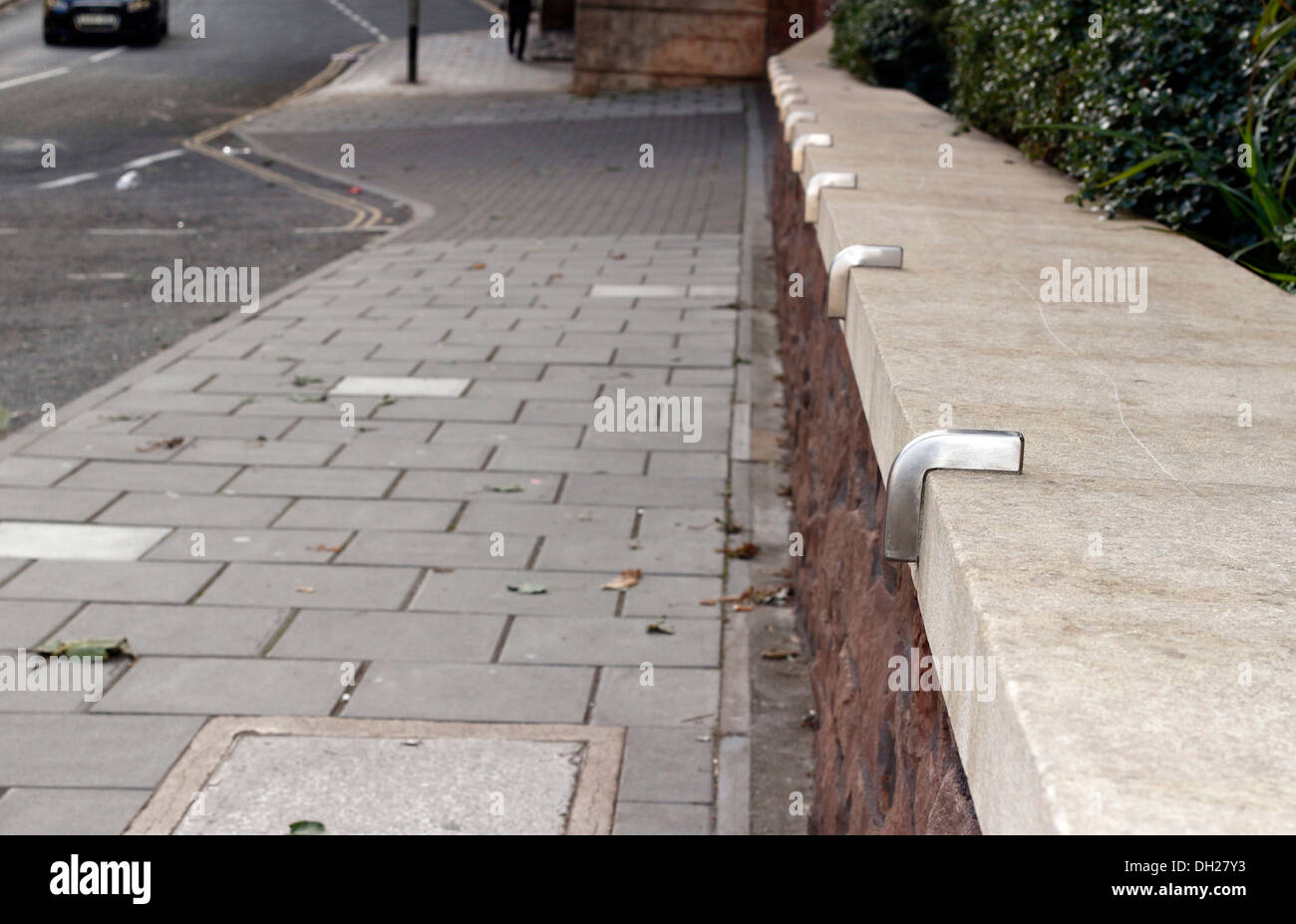Low wall in the center of Bristol, complete with steel brackets to stop ...