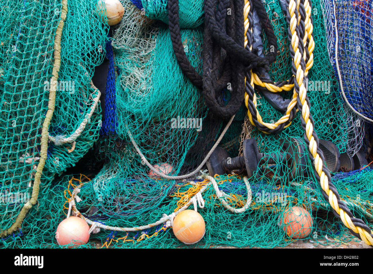 Fishing nets collected at fishing village Stock Photo - Alamy