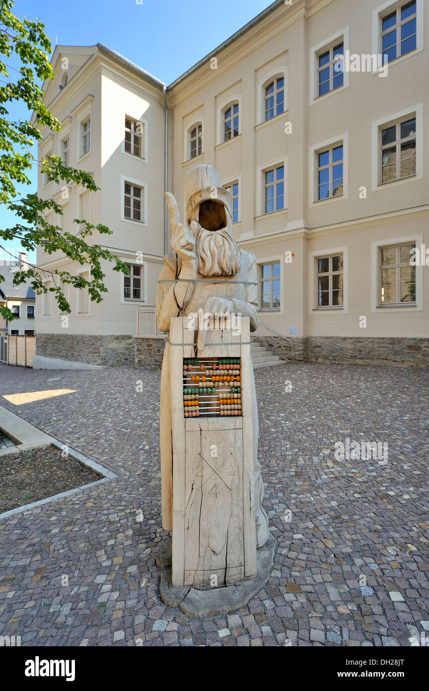 Wooden sculpture of Adam Ries in front of the Adam Ries educational ...