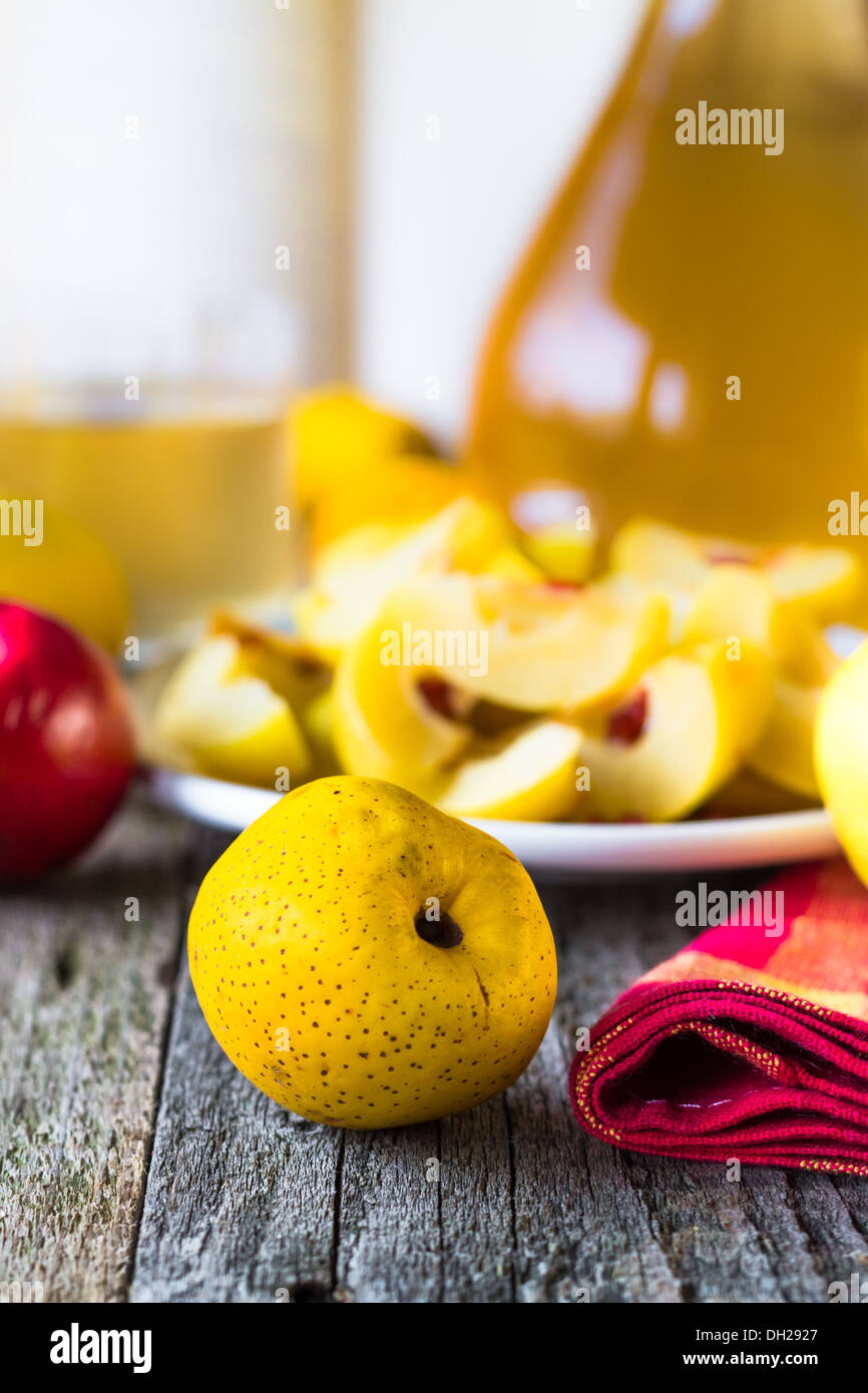 Cut fruit quince, apples and ready tincture Stock Photo - Alamy