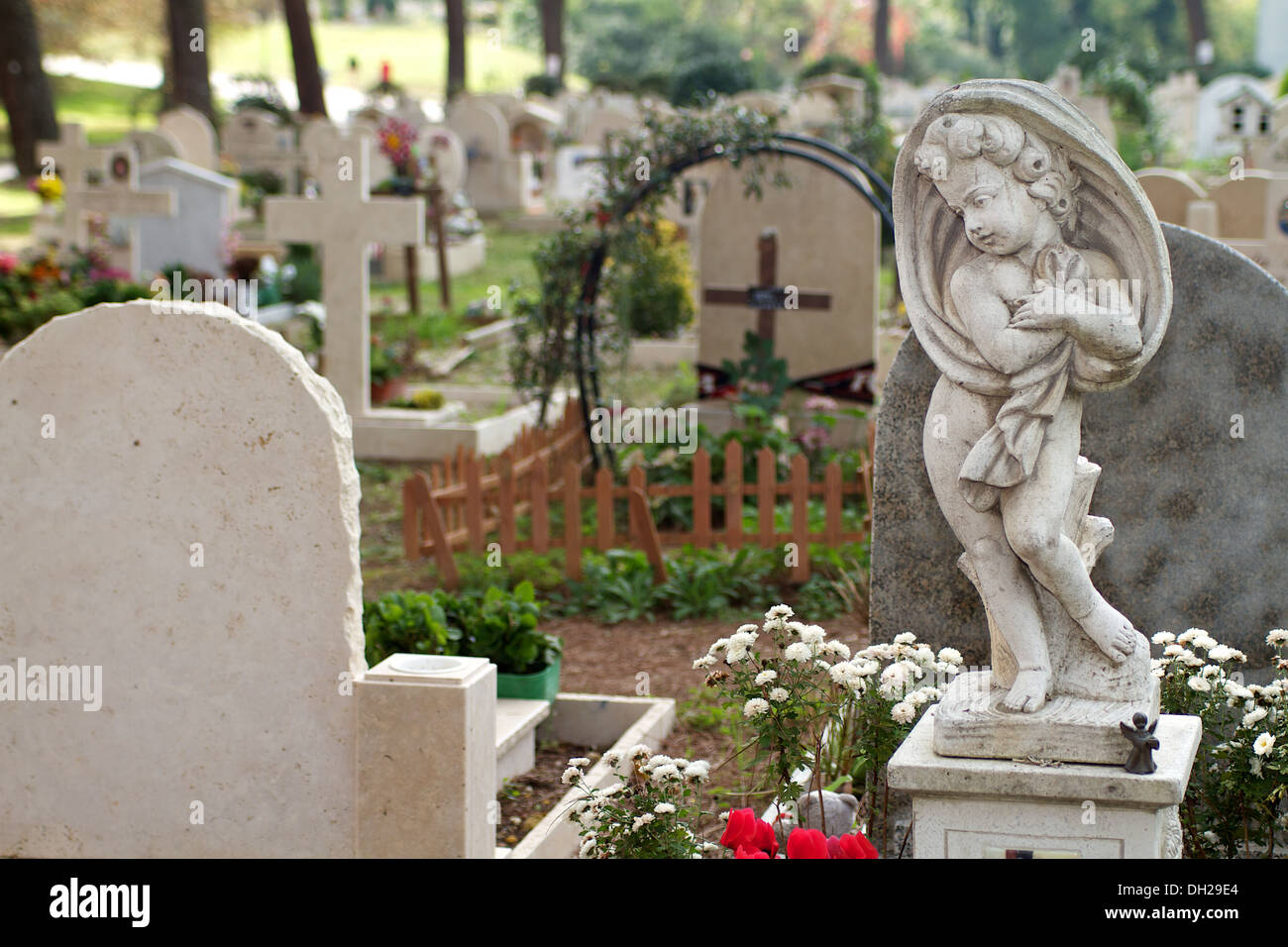 Jesus in cemetery, with green around Stock Photo - Alamy