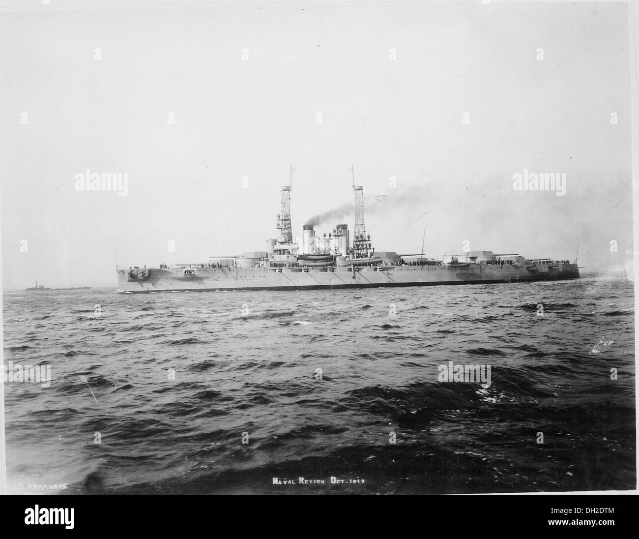 The USS Arkansas (BB-33) is shown underway, with a port-side view taken ...
