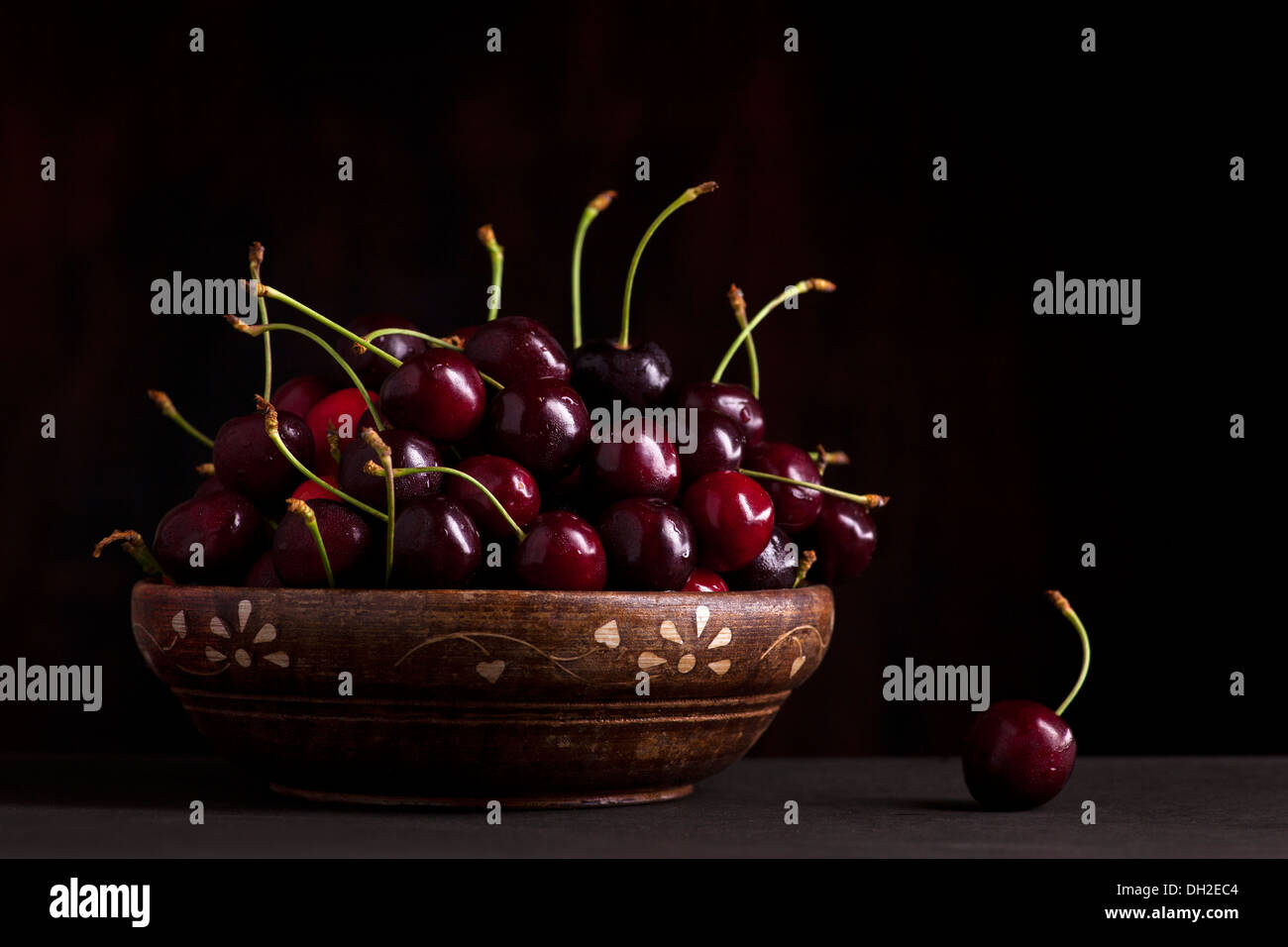 fresh cherries in a bowl on white background Stock Photo - Alamy