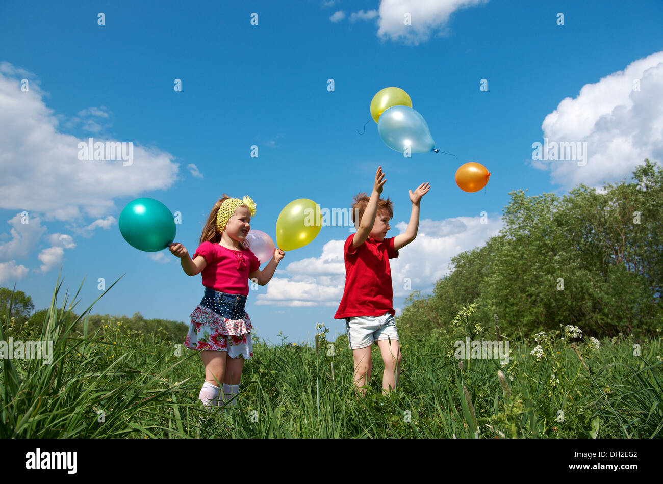 Children with balloon hi-res stock photography and images - Alamy