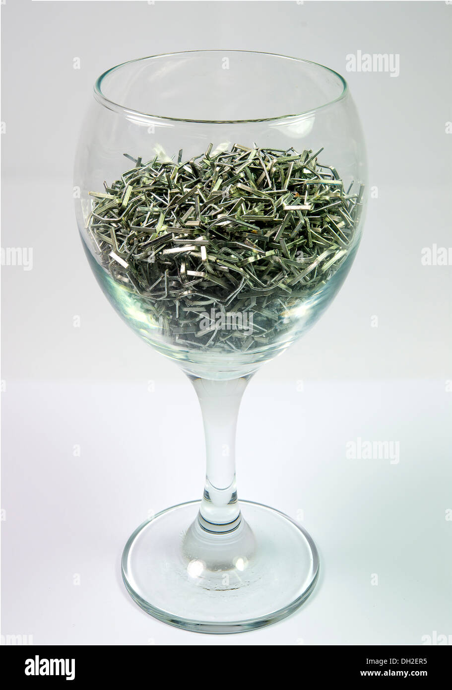 Glass of uses staples Stock Photo - Alamy