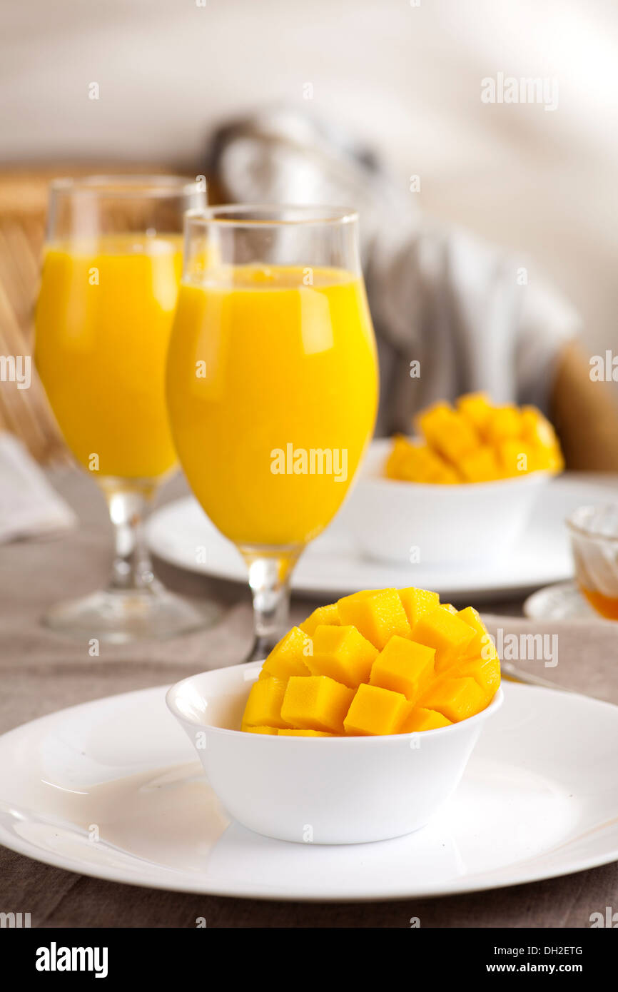Fresh golden mango served with mango smoothie Stock Photo - Alamy
