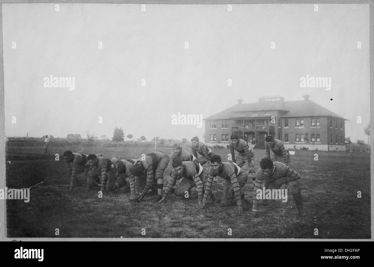 This historical photograph shows the football team at Haskell Institute ...