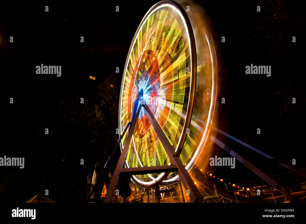 A ferris wheel moves in Okoboji at night Stock Photo - Alamy