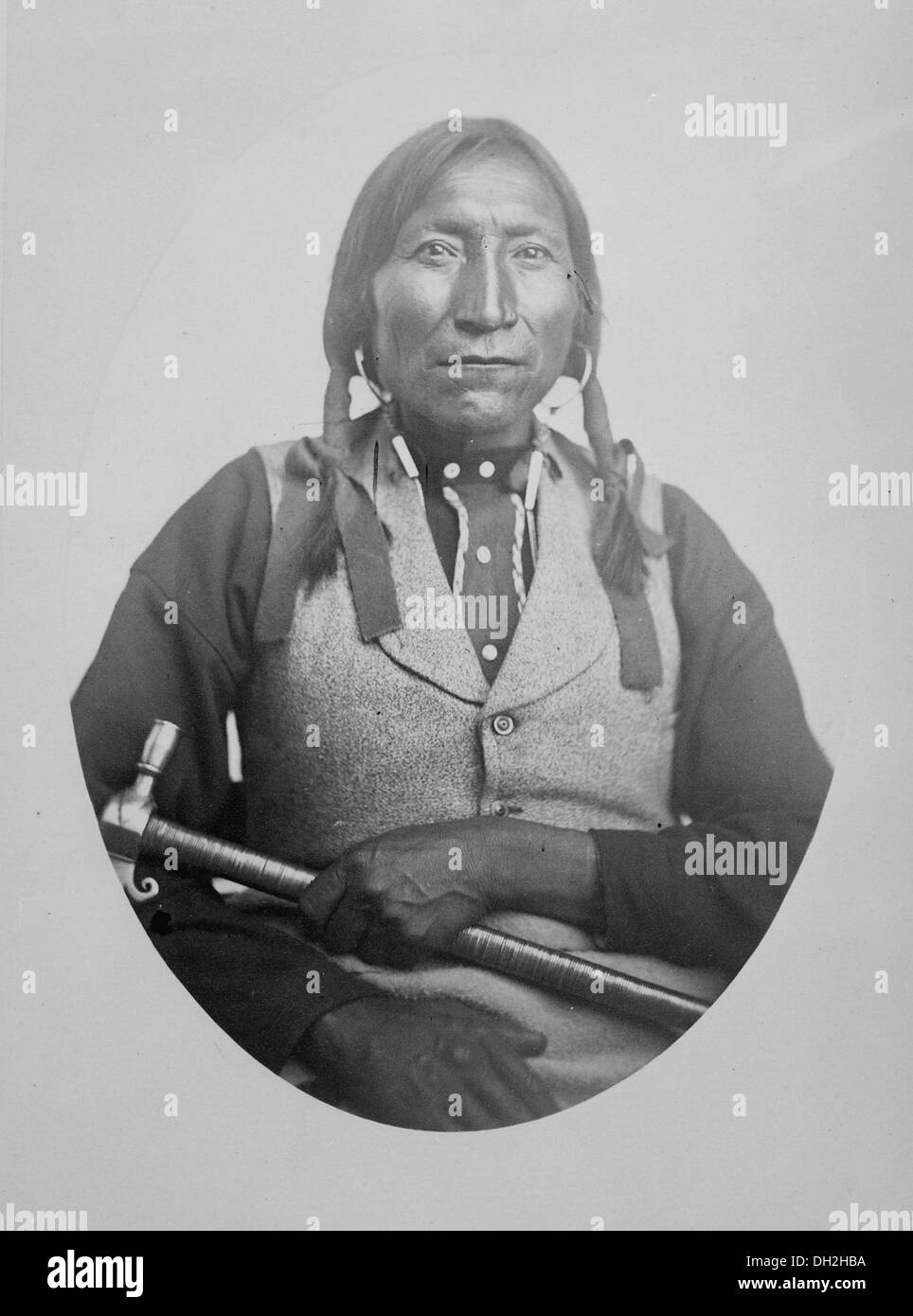Lone Wolfe (Guipago), a Kiowa chief, is shown seated in a half-length ...