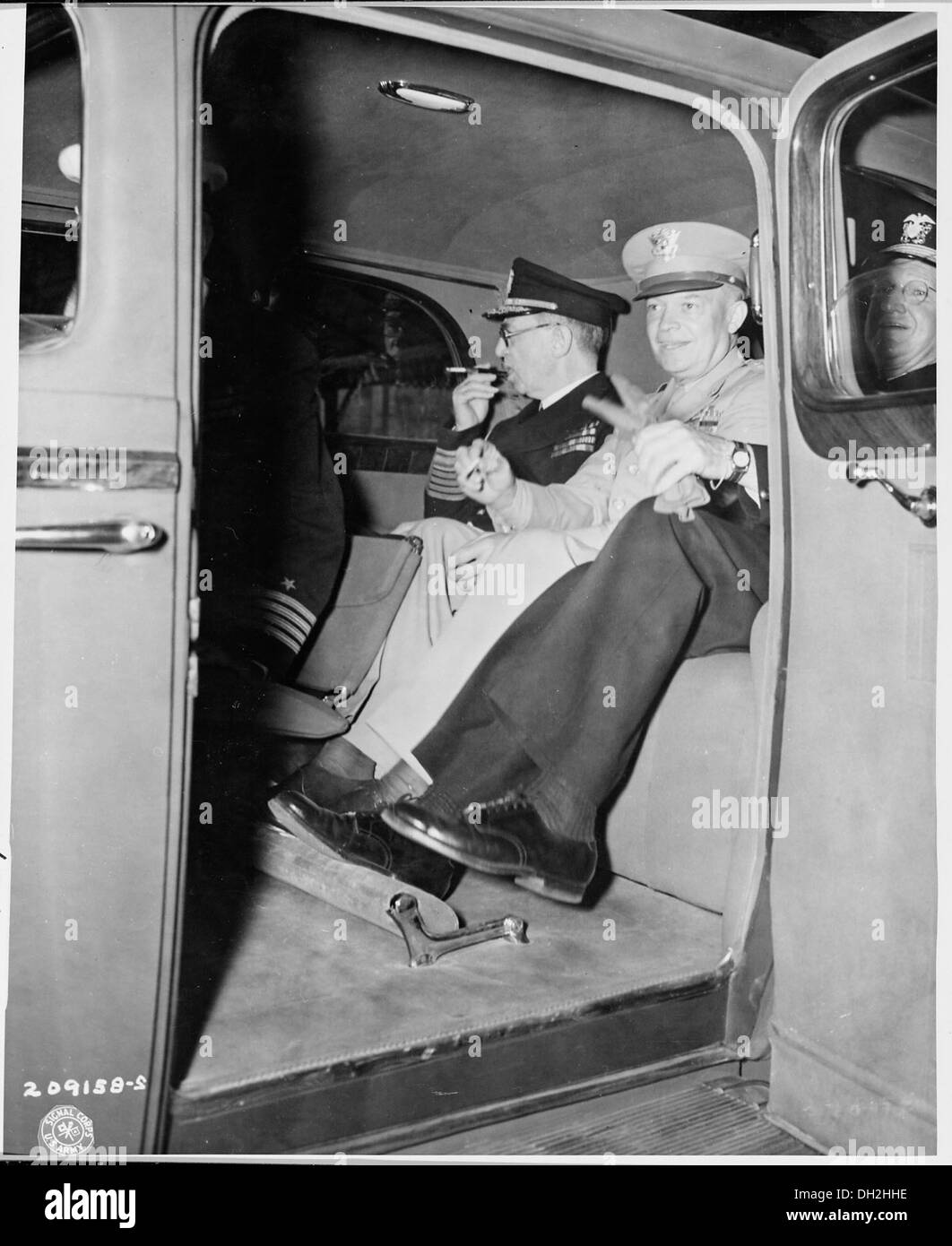 This image shows Adm. Harold Stark and Gen. Dwight D. Eisenhower ...