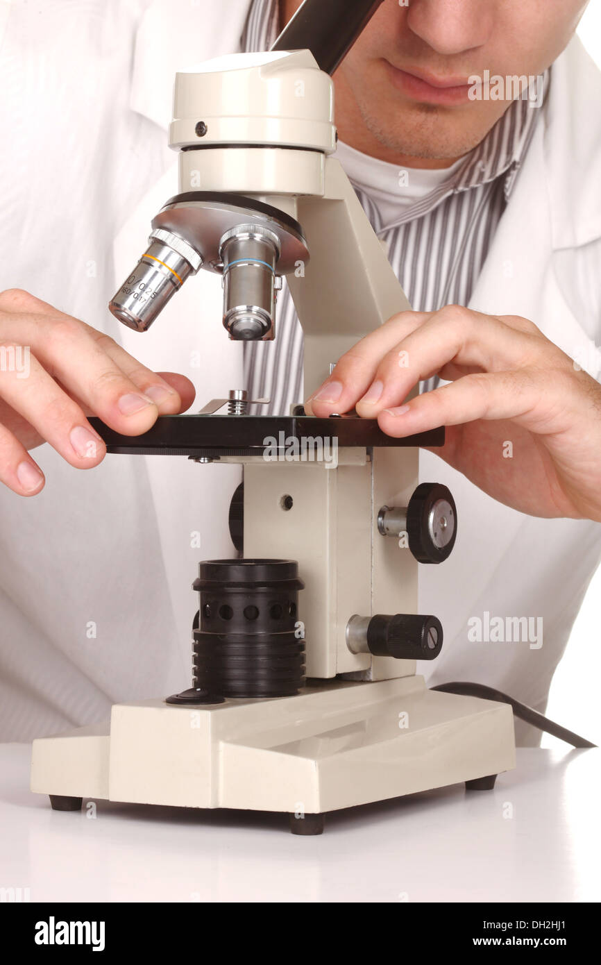 Scientist At Work Using a Microscope on White Stock Photo - Alamy