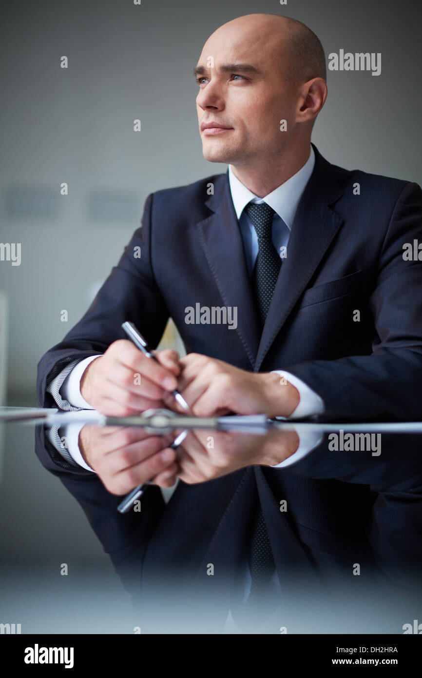 Image of pensive businessman at workplace Stock Photo - Alamy