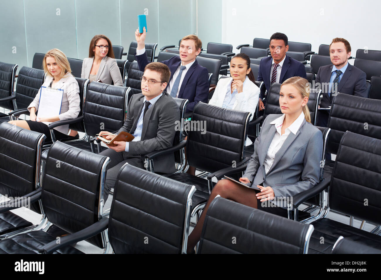 Image of business people sitting in rows at seminar Stock Photo - Alamy