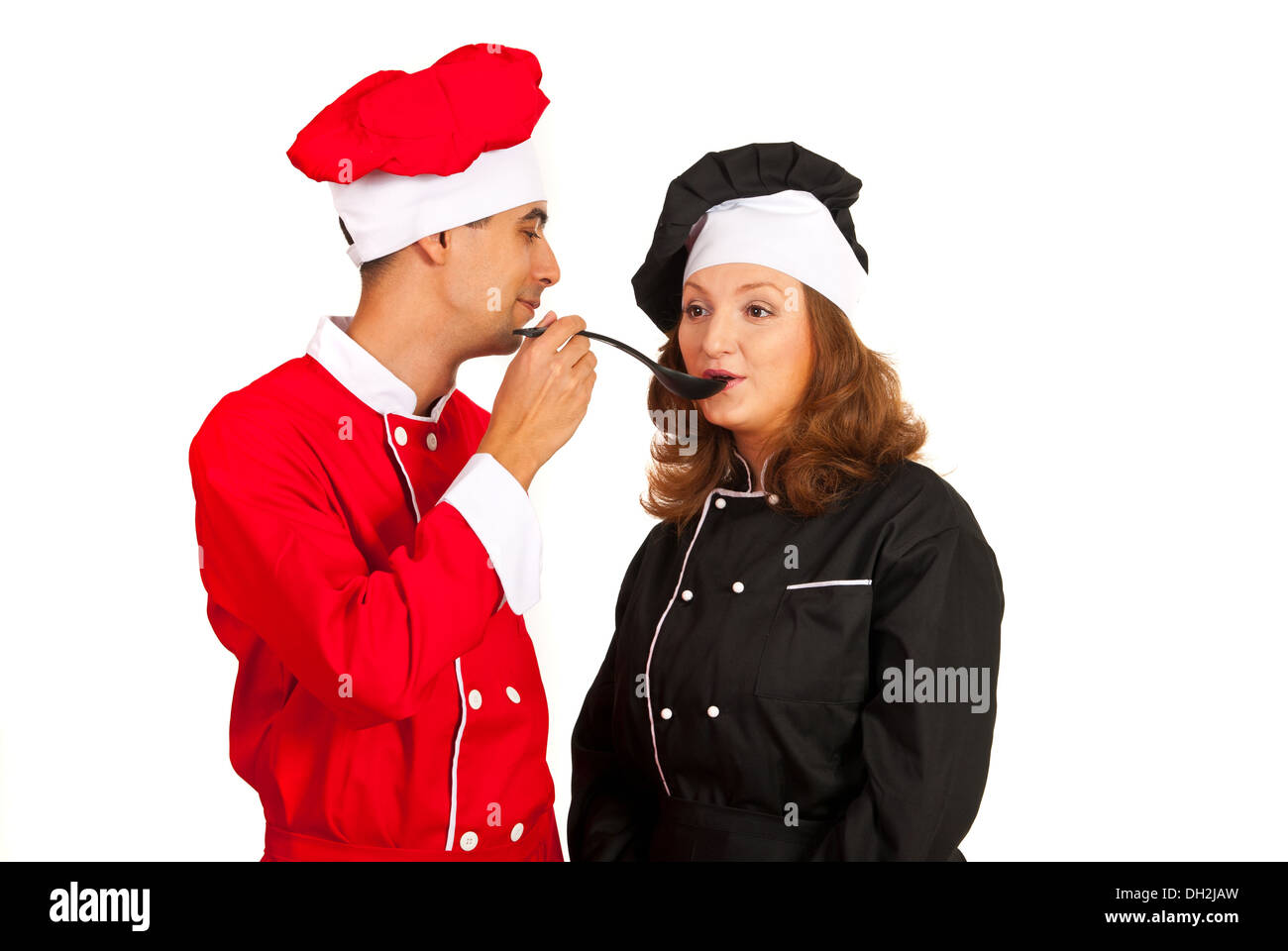Chefs couple tasting soup isolated on white background Stock Photo - Alamy