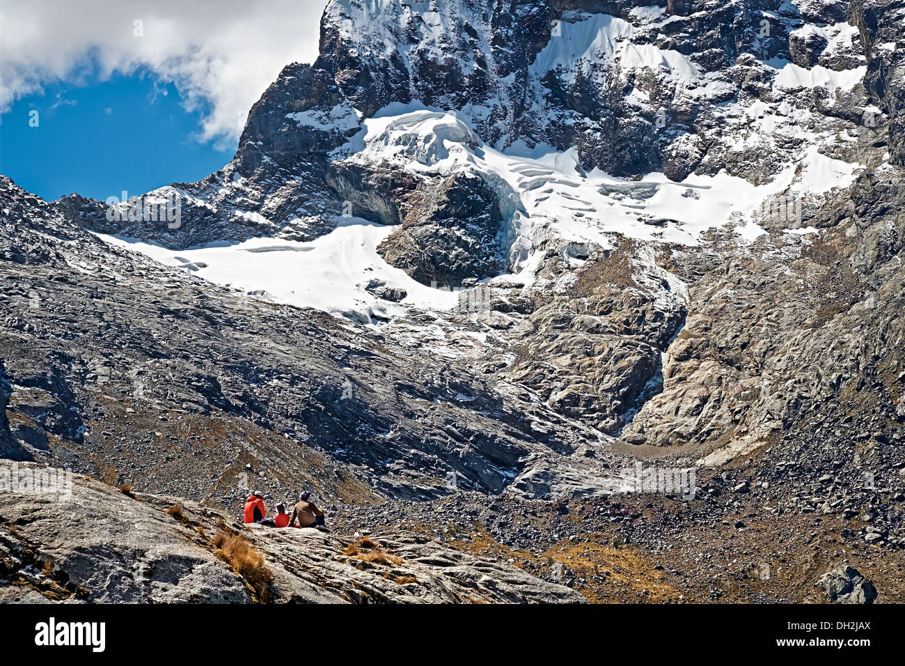 Hikers sitting below the Nev Churup Summit, Huascaran National Park in ...