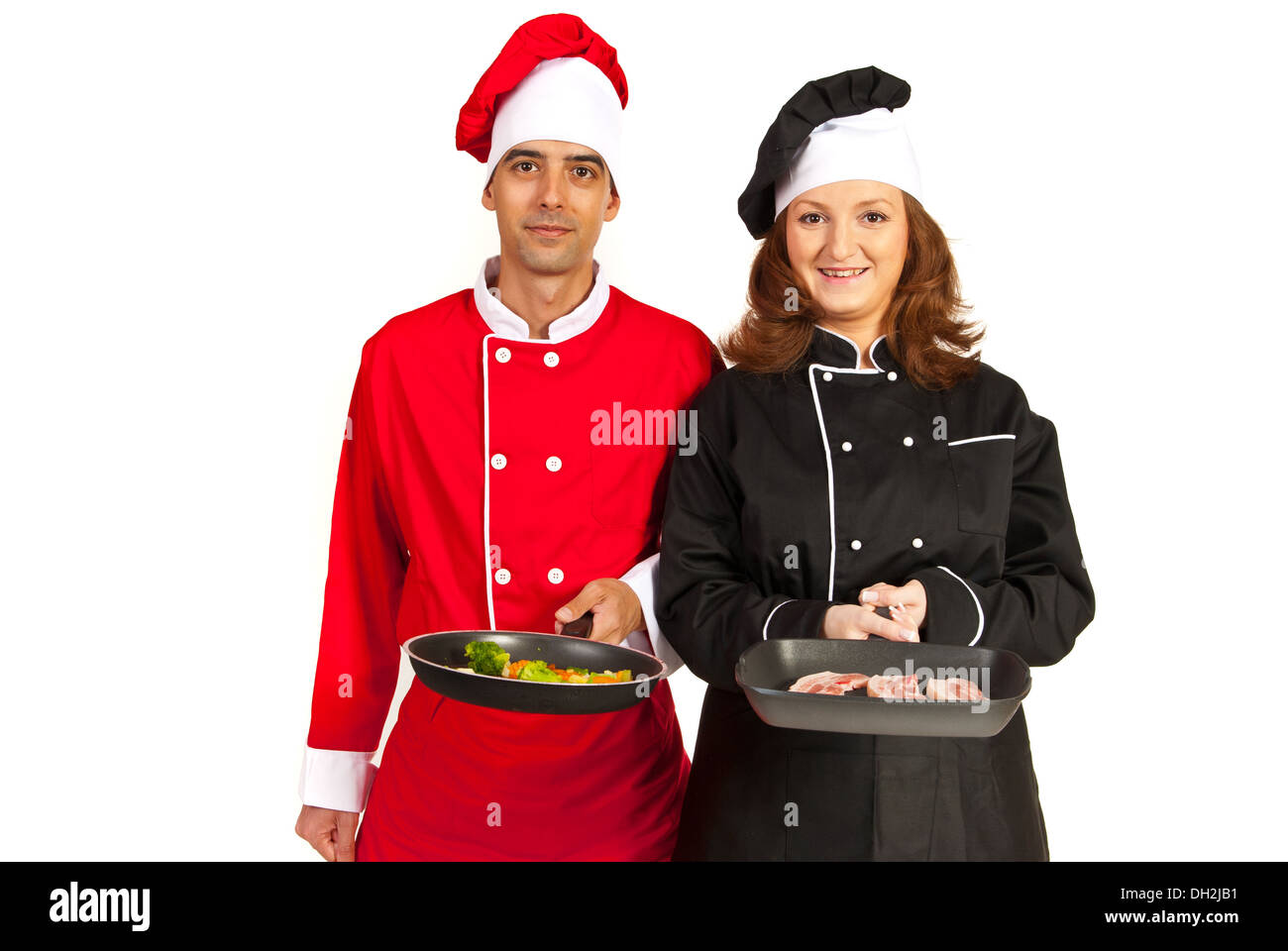 Two chefs showing frying pans with food isolated on white background ...