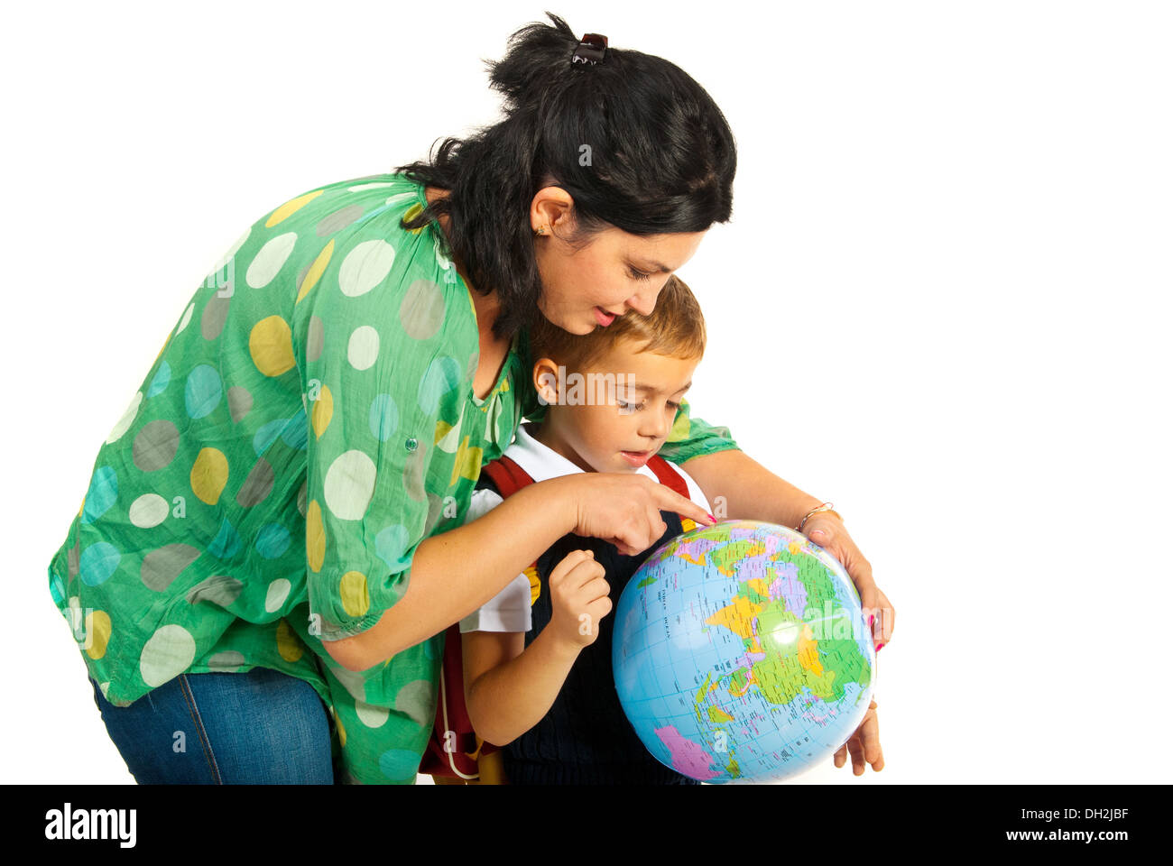 Mother showing countries to her son on a world globe Stock Photo - Alamy