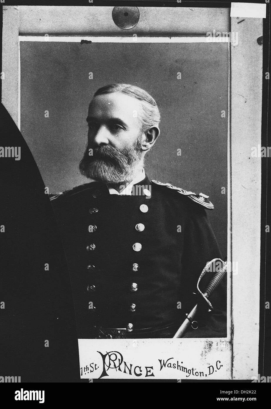 This is a portrait of a U.S. Navy officer, showcasing the formal attire ...