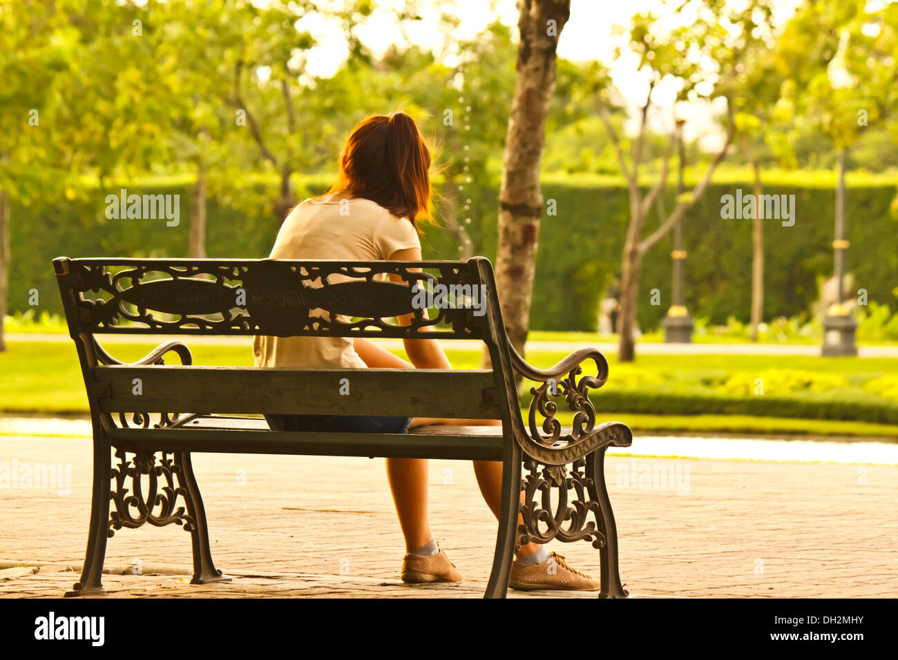 only lady seat on bench Stock Photo - Alamy