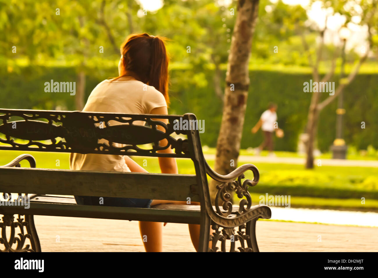 Beautiful girl sitting on bench hi-res stock photography and images - Alamy