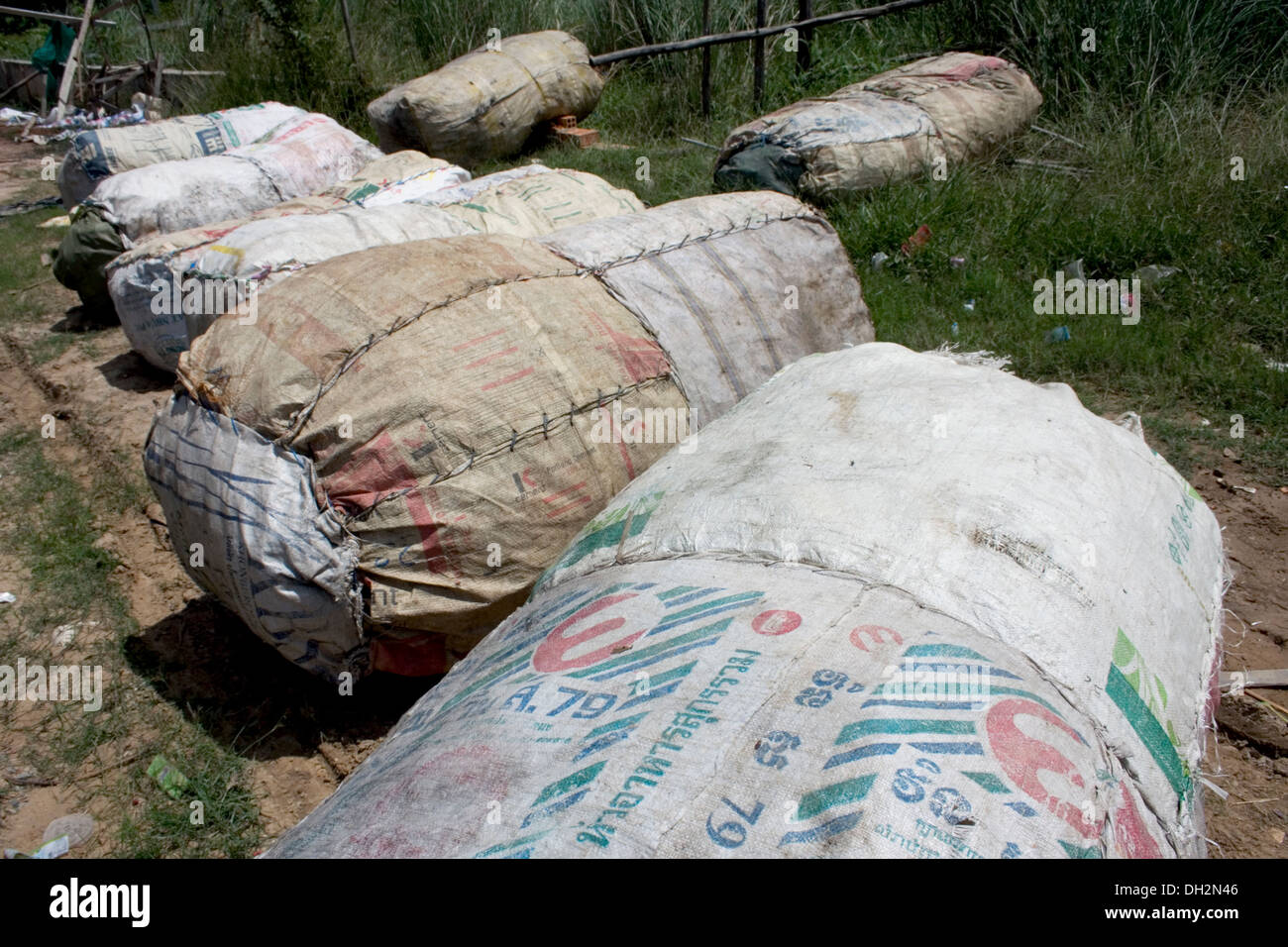 Large cement sacks containg recyclable material await pickup at a ...
