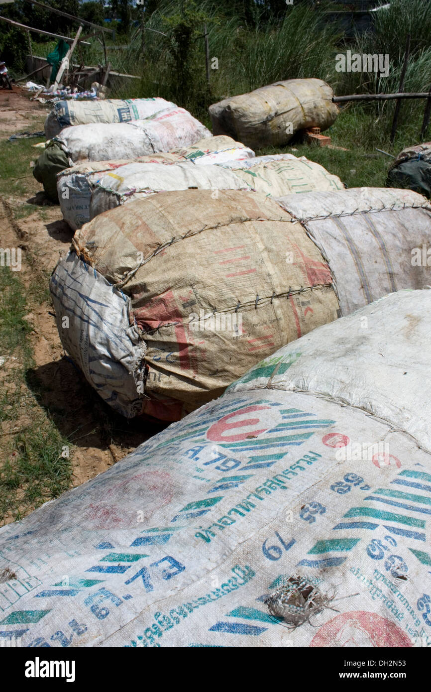 Large cement sacks containg recyclable material await pickup at a ...