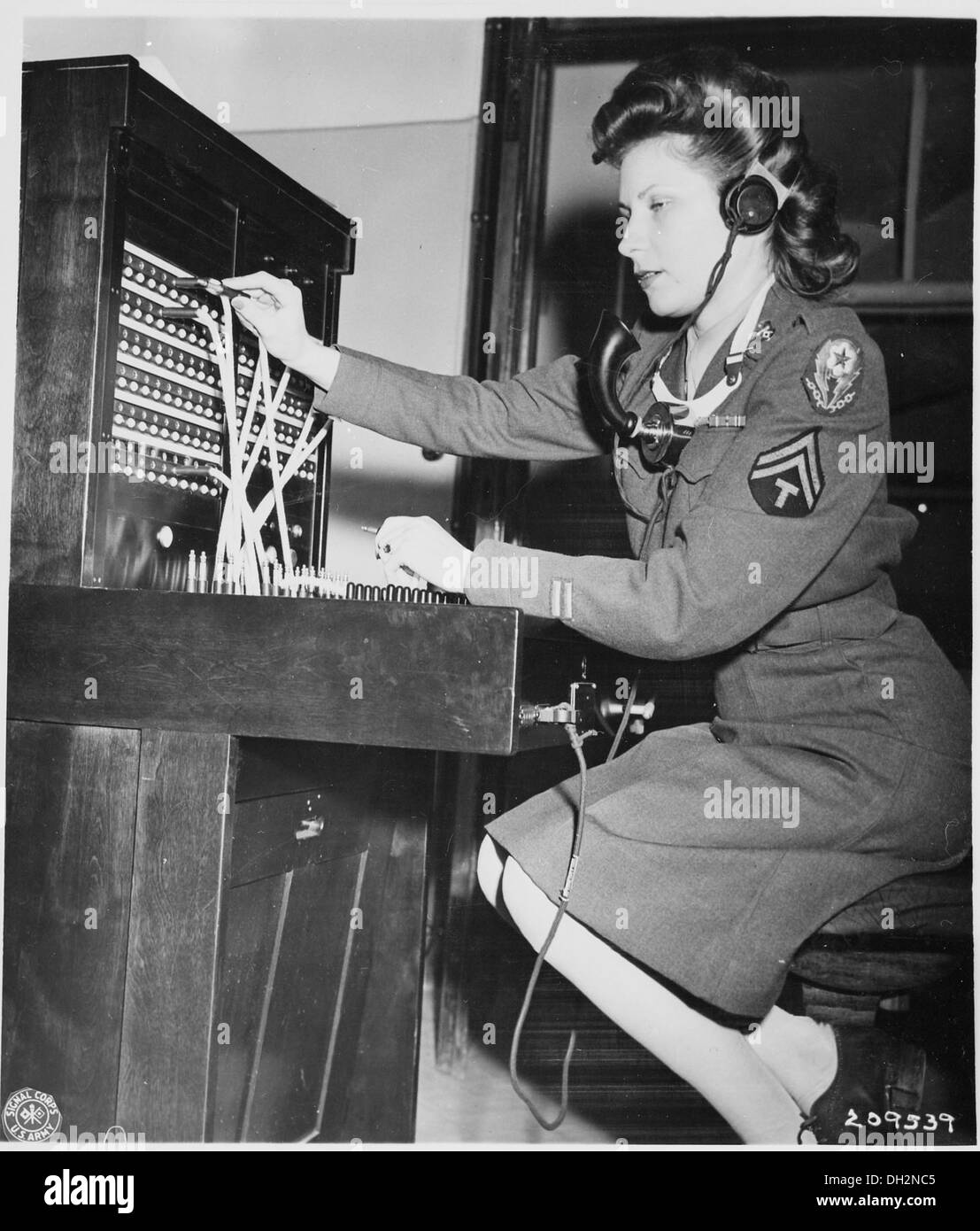 WAC Corporal Alma Bradley operates the switchboard at the Little White ...