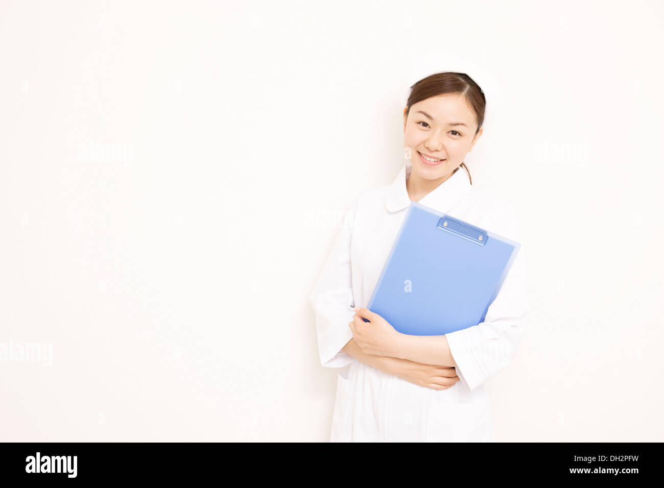 Nurse holding a binder hi-res stock photography and images - Alamy
