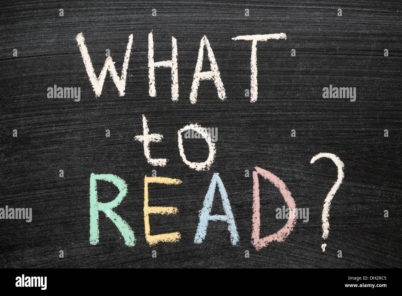 what to read question handwritten on school blackboard Stock Photo - Alamy