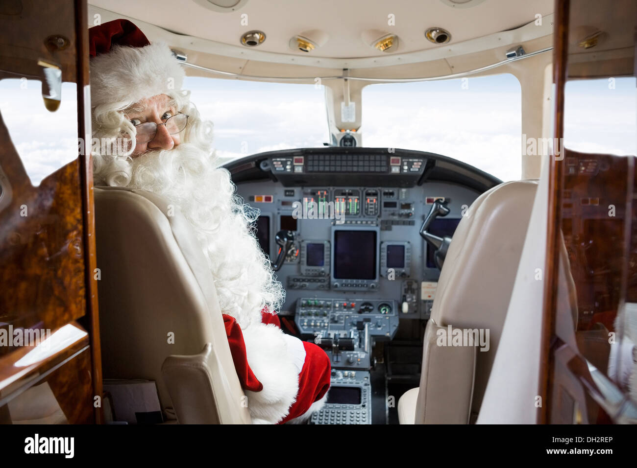 Santa Sitting In Cockpit Of Private Jet Stock Photo - Alamy