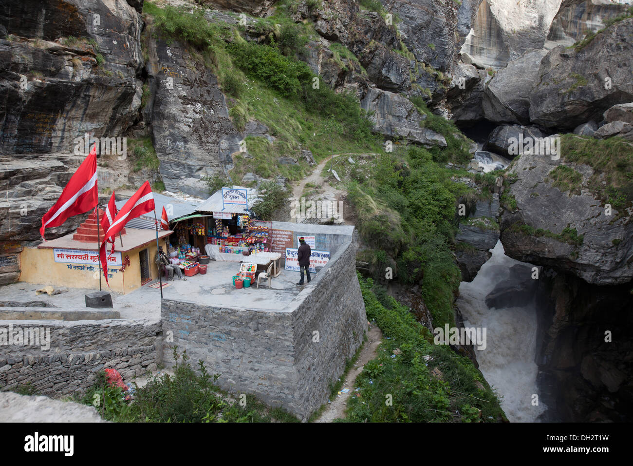temple and shop next to alaknanda river in Mana Village badrinath ...