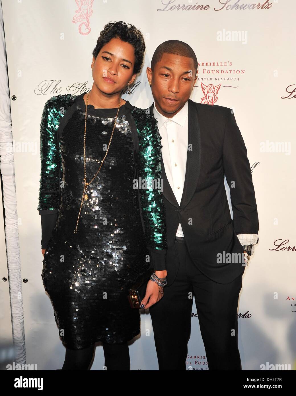 New York, NY, USA. 29th Oct, 2013. Pharrell Williams, Helen Lasichanh ...