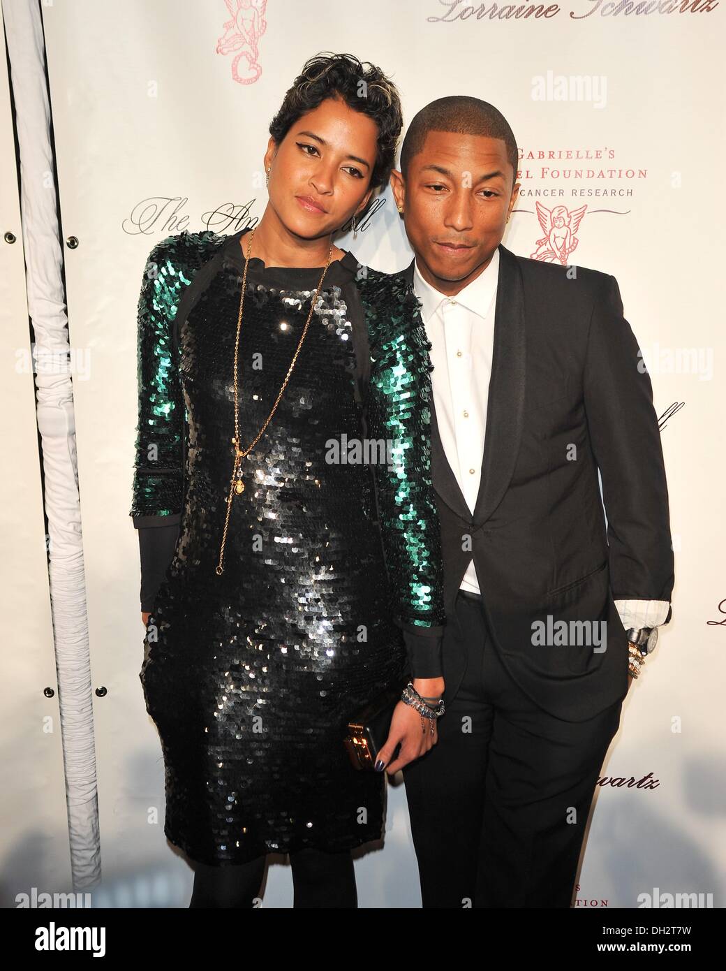 New York, NY, USA. 29th Oct, 2013. Pharrell Williams, Helen Lasichanh ...