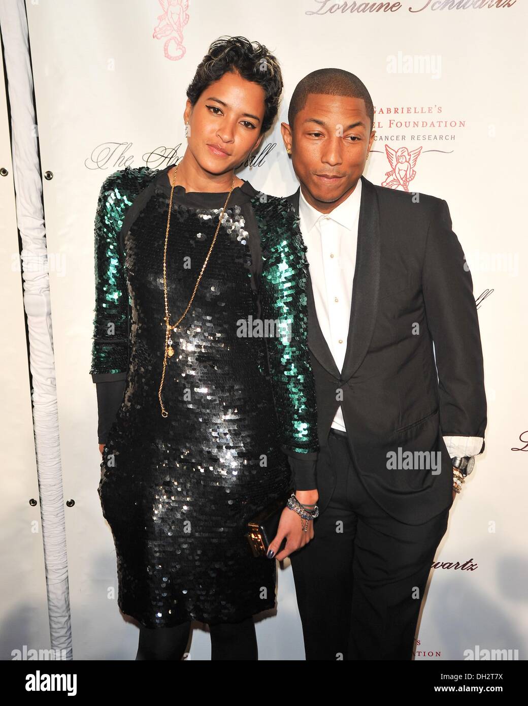 New York, NY, USA. 29th Oct, 2013. Pharrell Williams, Helen Lasichanh ...