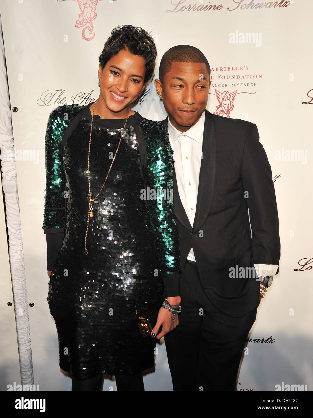 New York, NY, USA. 29th Oct, 2013. Pharrell Williams, Helen Lasichanh ...